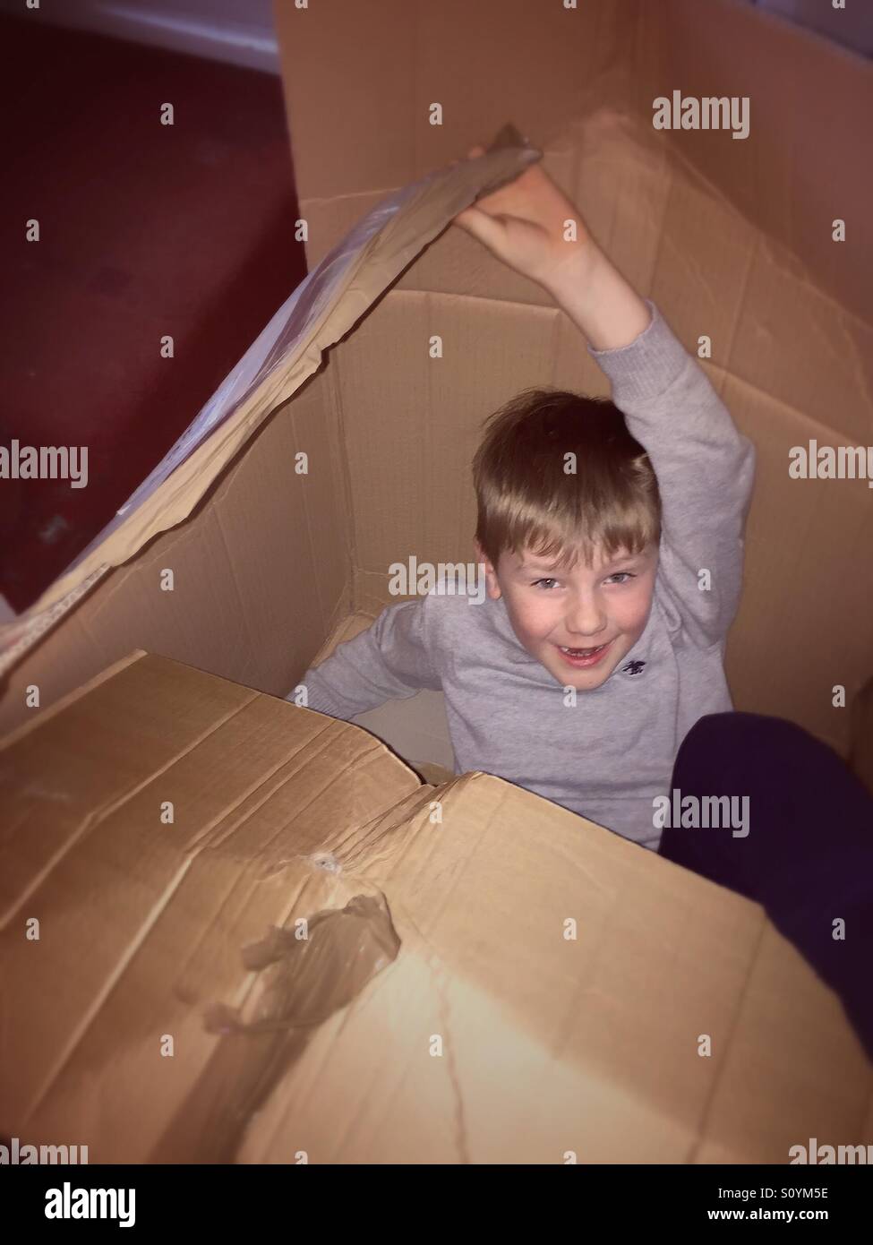 Boy in a box hi-res stock photography and images - Alamy