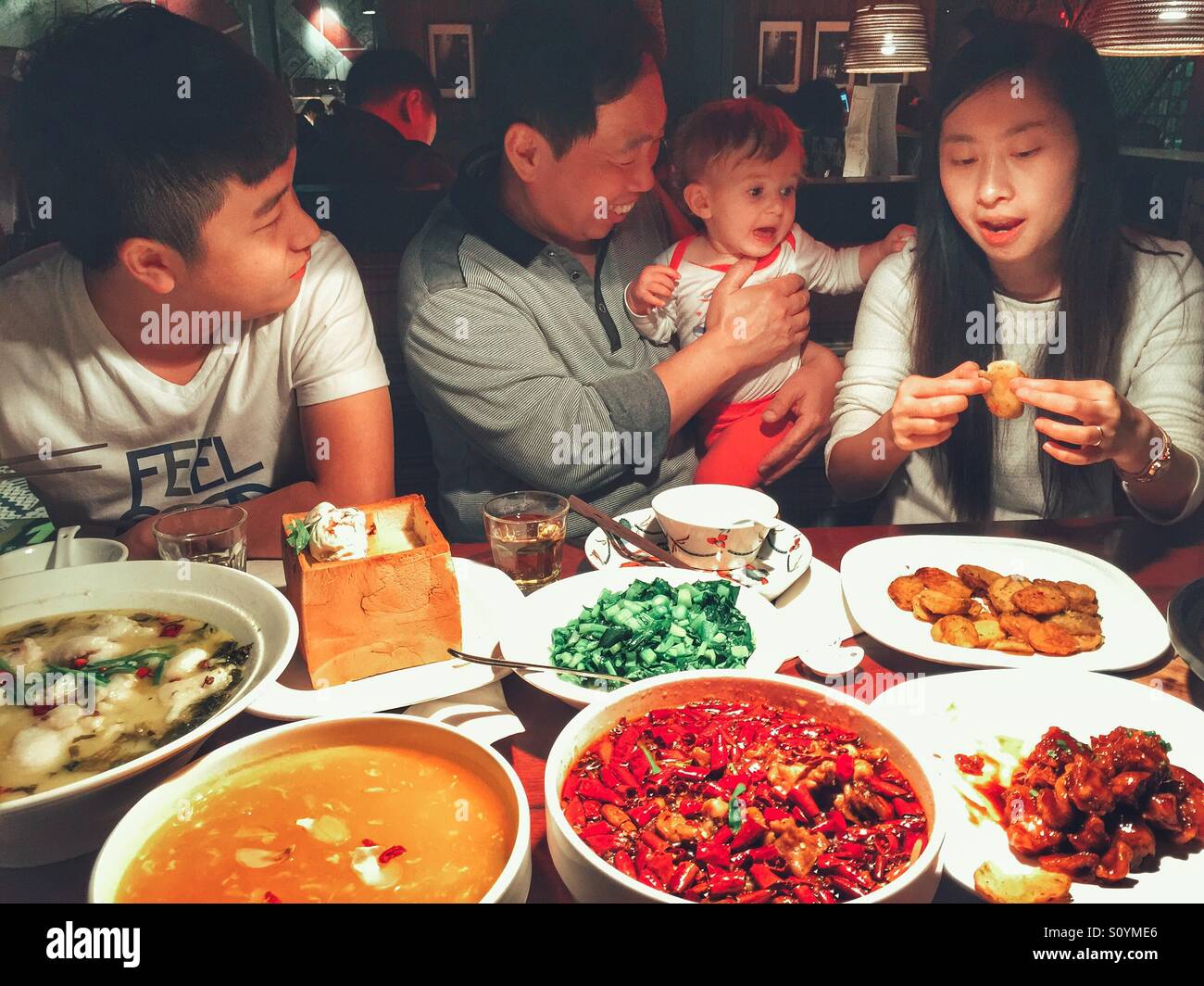 Chinese eating in restaurant Stock Photo - Alamy