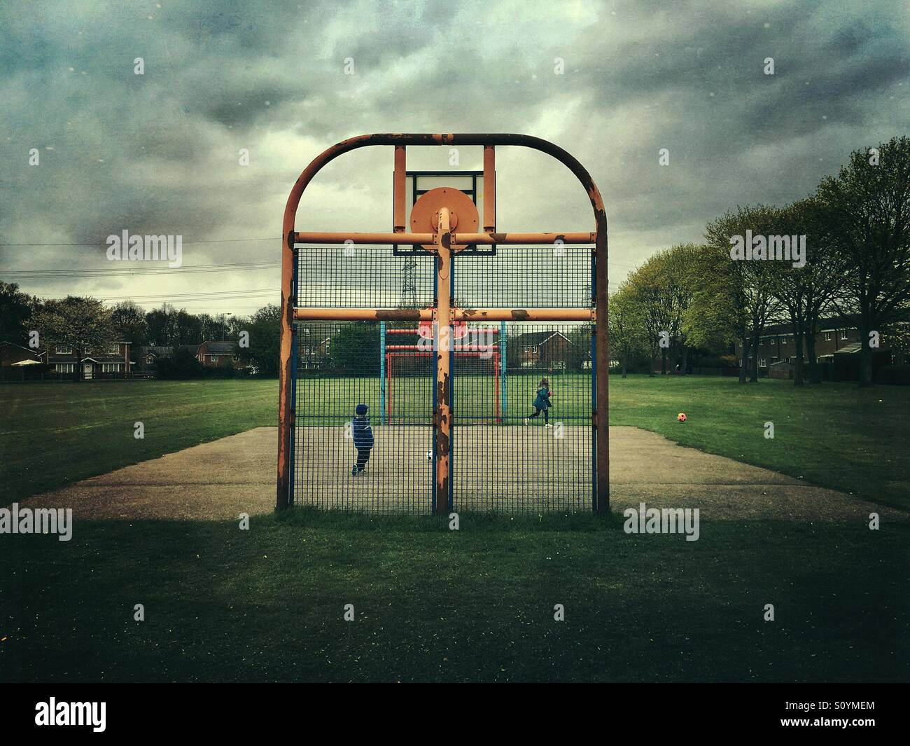 Kids playing in Basketball Court Stock Photo - Alamy