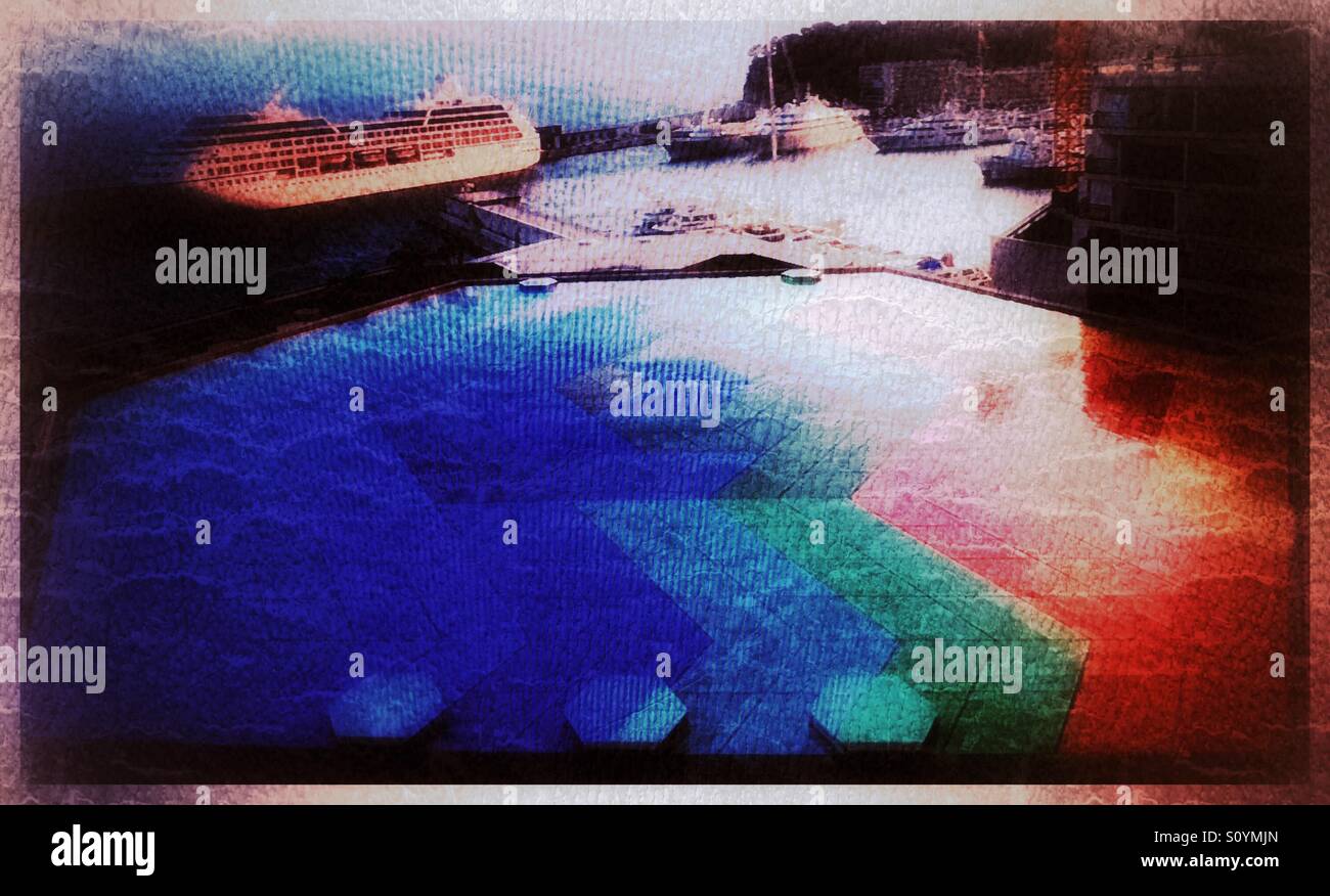 Colorful rooftop in the French Riviera with a crew ship and a marina in ...