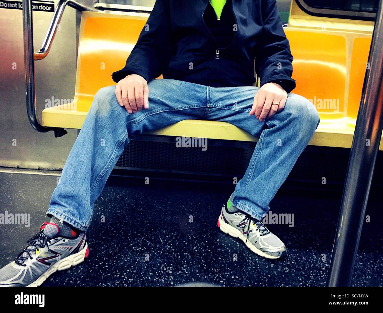 Man spreading subway hi-res stock photography and images - Alamy