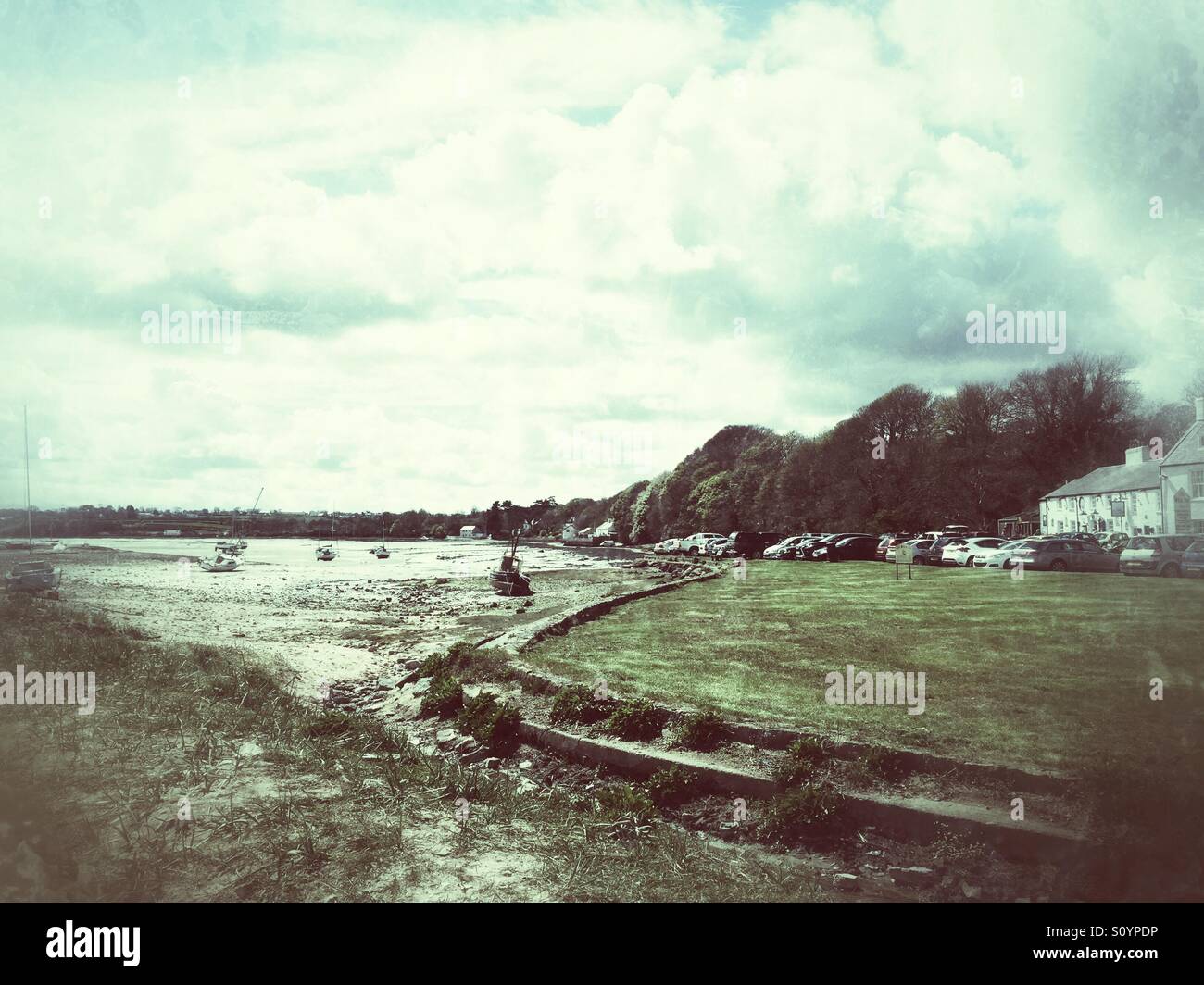 Low tide at Red Wharf Bay, Anglesey, North Wales. By The Ship Inn Stock ...
