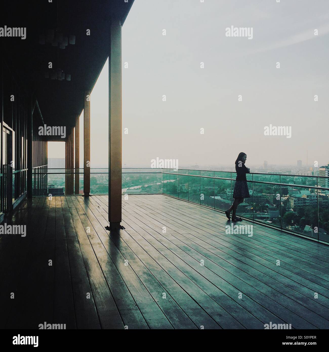 Woman balcony building hi-res stock photography and images - Alamy