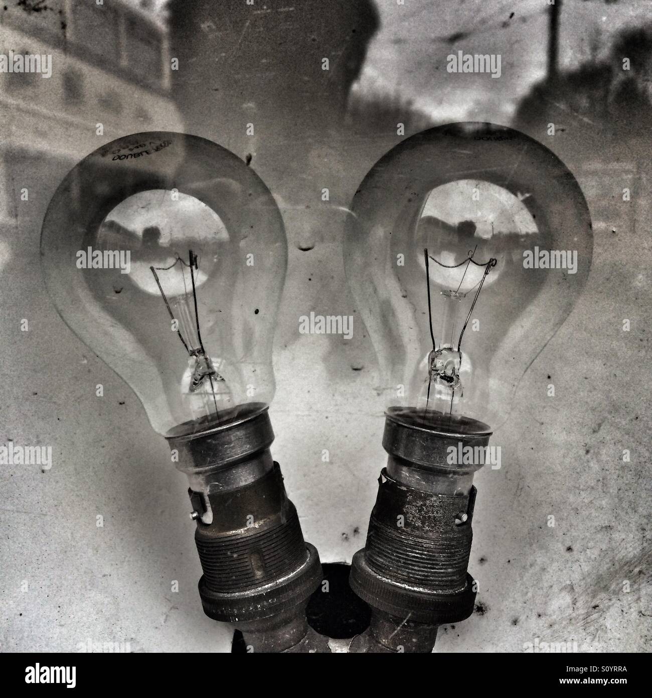 Light bulbs resembling eyes in an old headlamp Stock Photo - Alamy