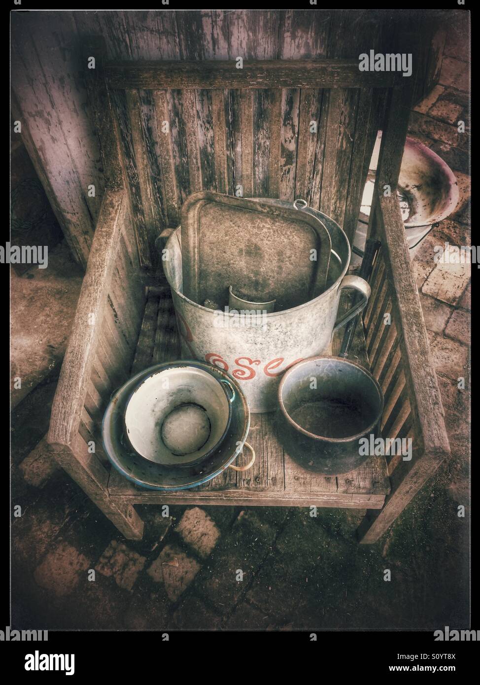 Still life with vintage pots on chair Stock Photo - Alamy