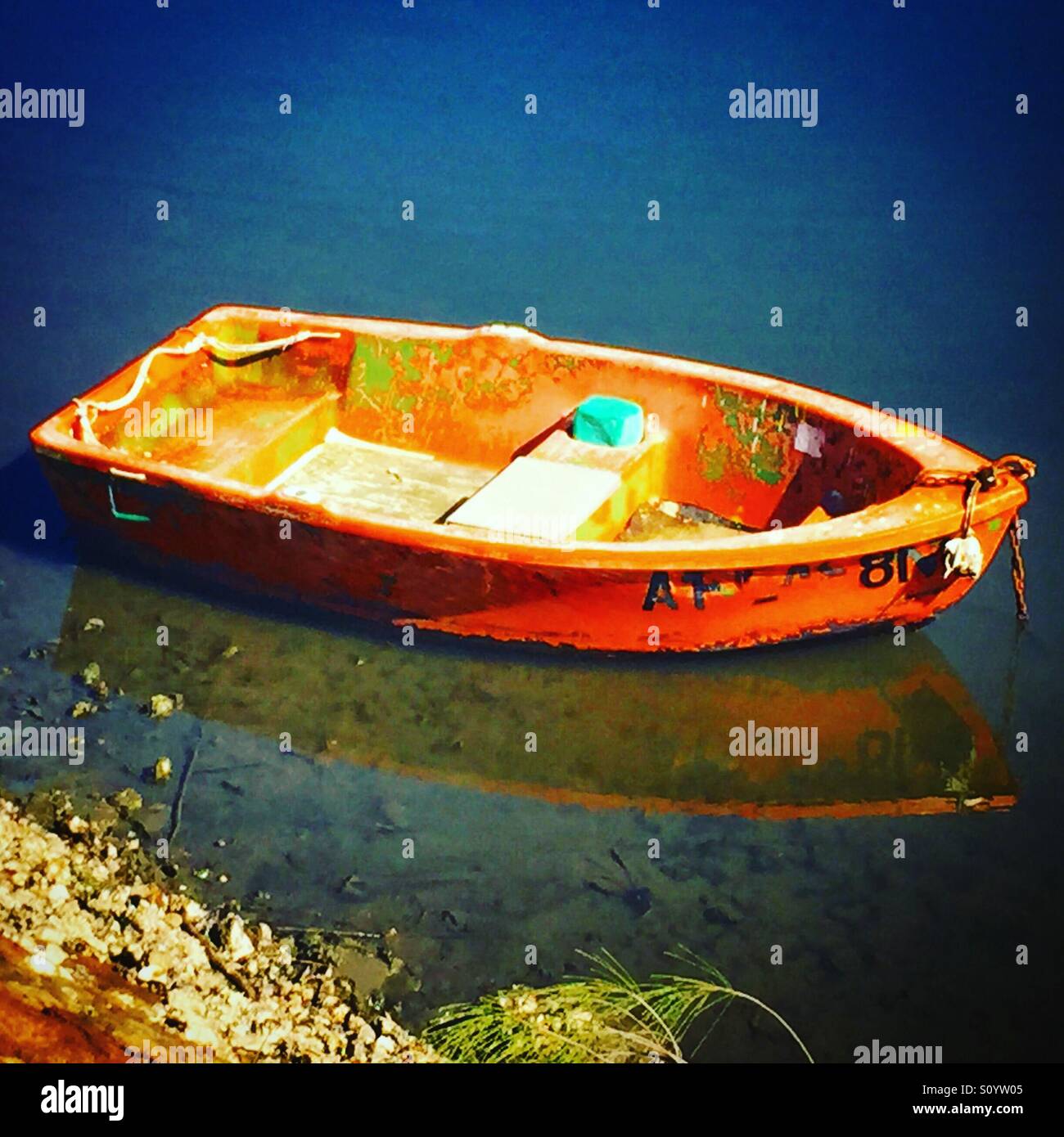 Orange boat in lake Stock Photo - Alamy