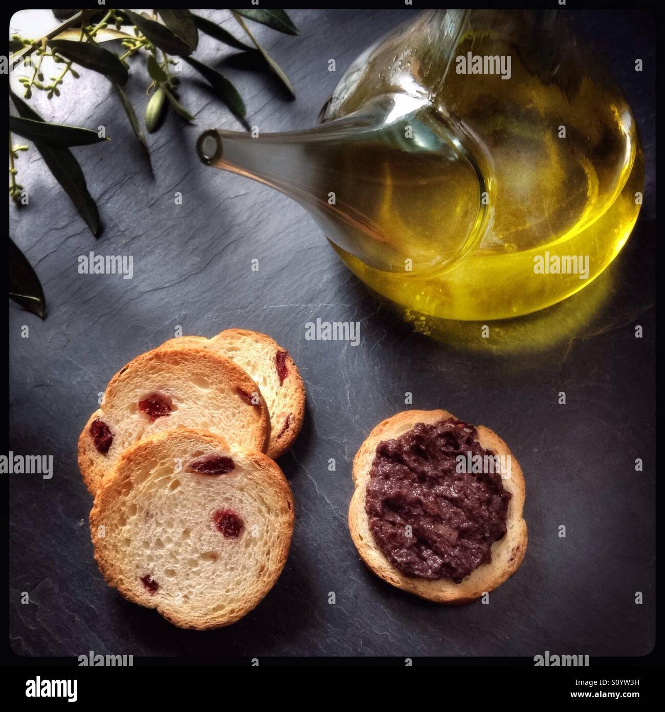 Home-cured black-ripened Spanish Empeltre olive tapenade with cruet of ...