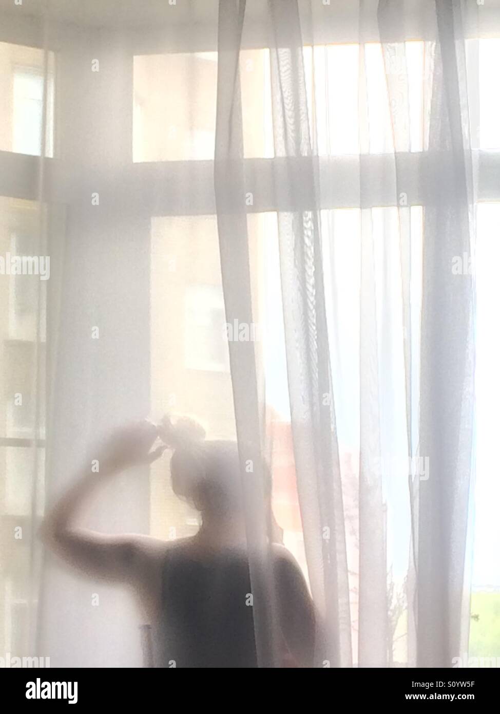 Behind the curtain Stock Photo - Alamy