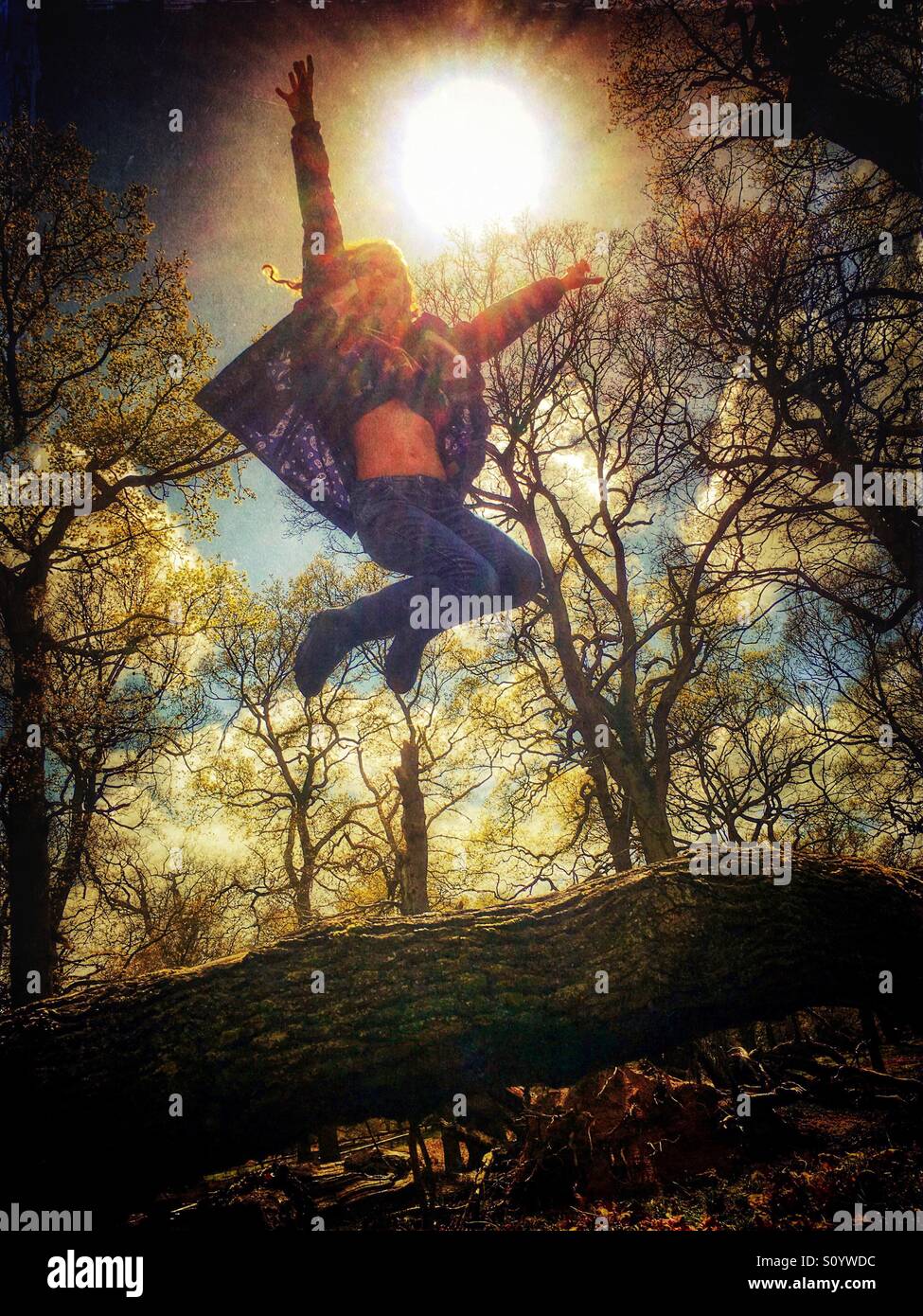 Jump for joy in the forest Stock Photo - Alamy