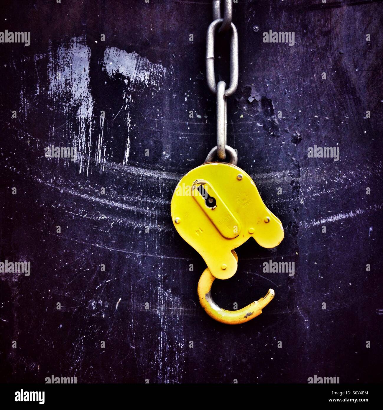 Bright yellow open padlock against distressed dark background Stock ...