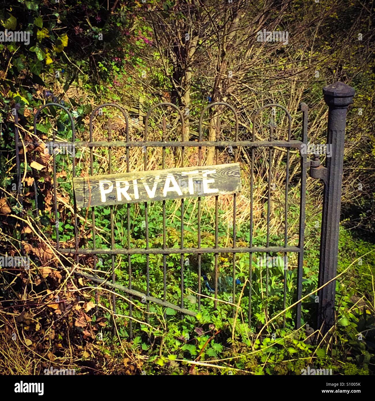 Private sign on an old metal gate Stock Photo - Alamy