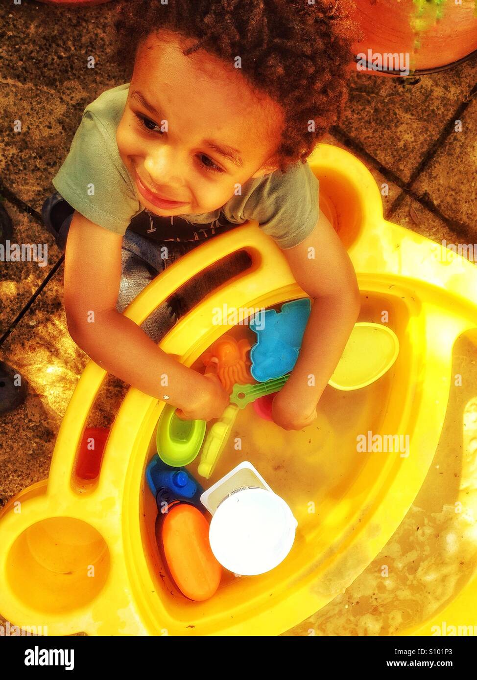 A little boy playing outside Stock Photo - Alamy