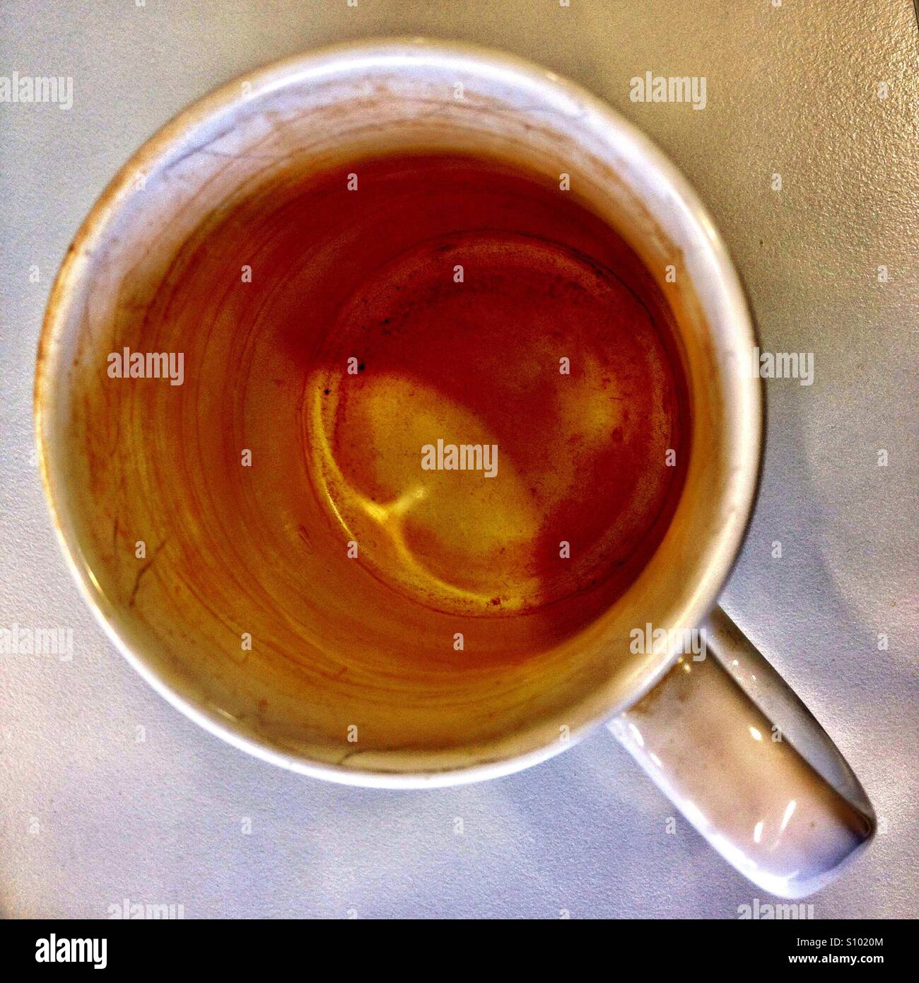 The inside of a dirty mug stained why tea Stock Photo - Alamy