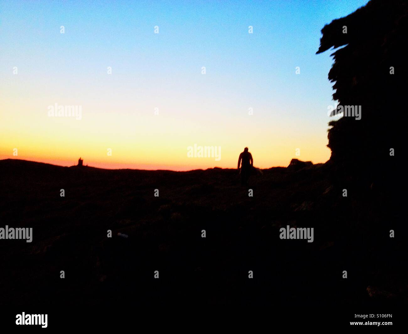 Man in sunset landscape Stock Photo - Alamy