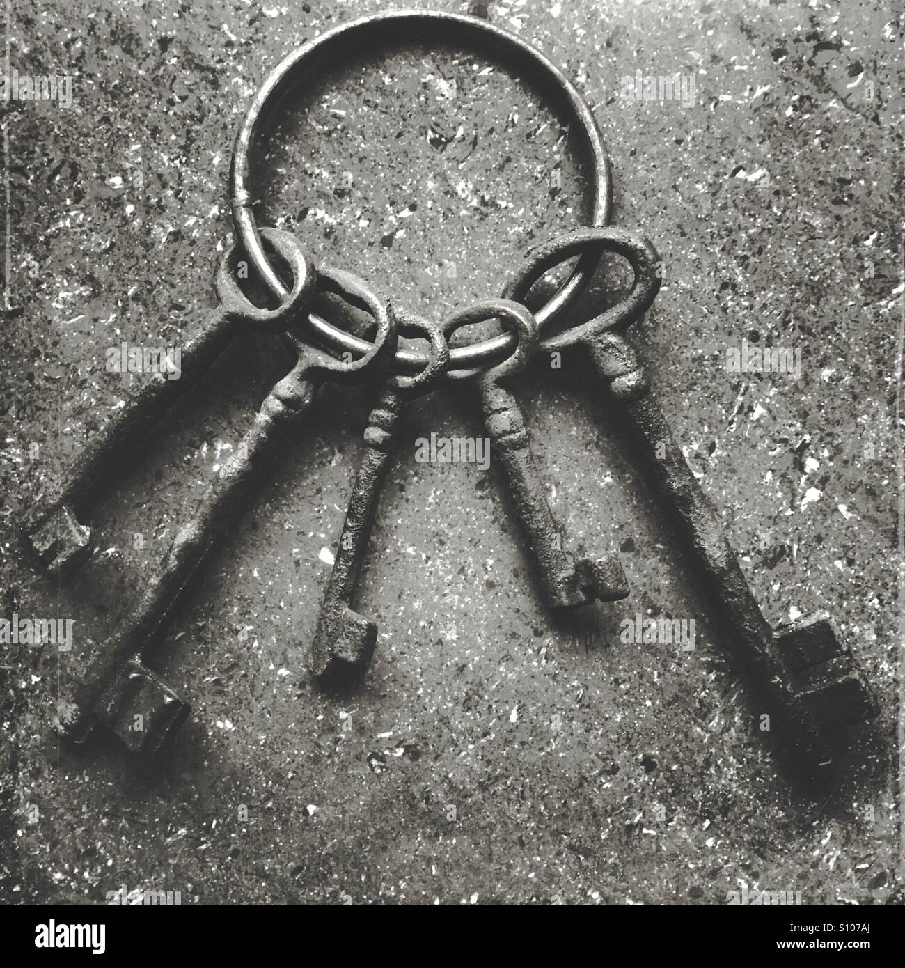 Medieval keys on marble background in black and white Stock Photo - Alamy