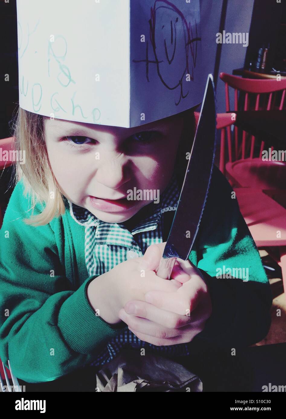 Girl with knife Stock Photo - Alamy