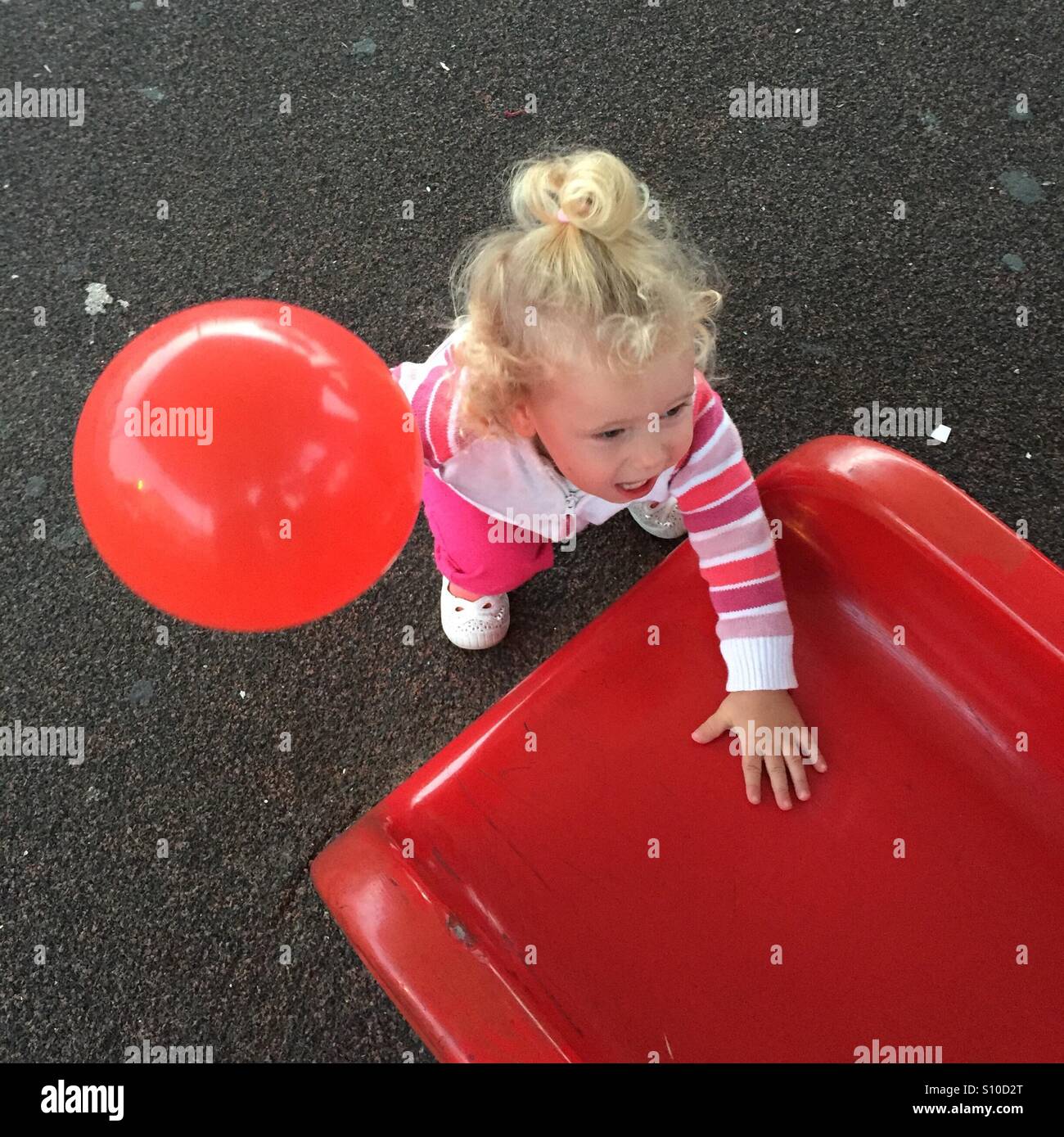 Happy toddler at playground Stock Photo - Alamy