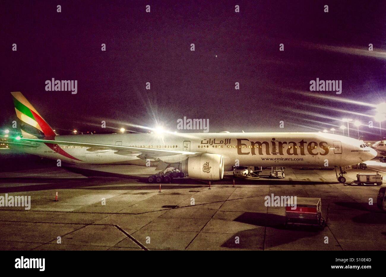 Emirates Airline airplane parked at the stand of Dubai International ...