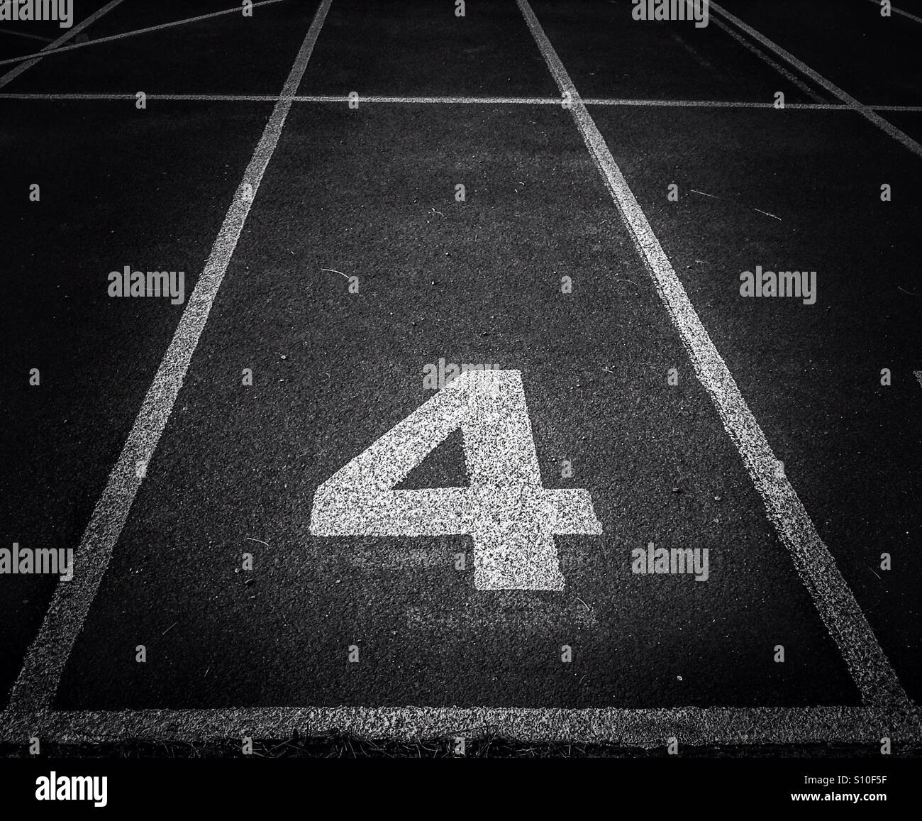 Number four (4) on an athletics track Stock Photo - Alamy