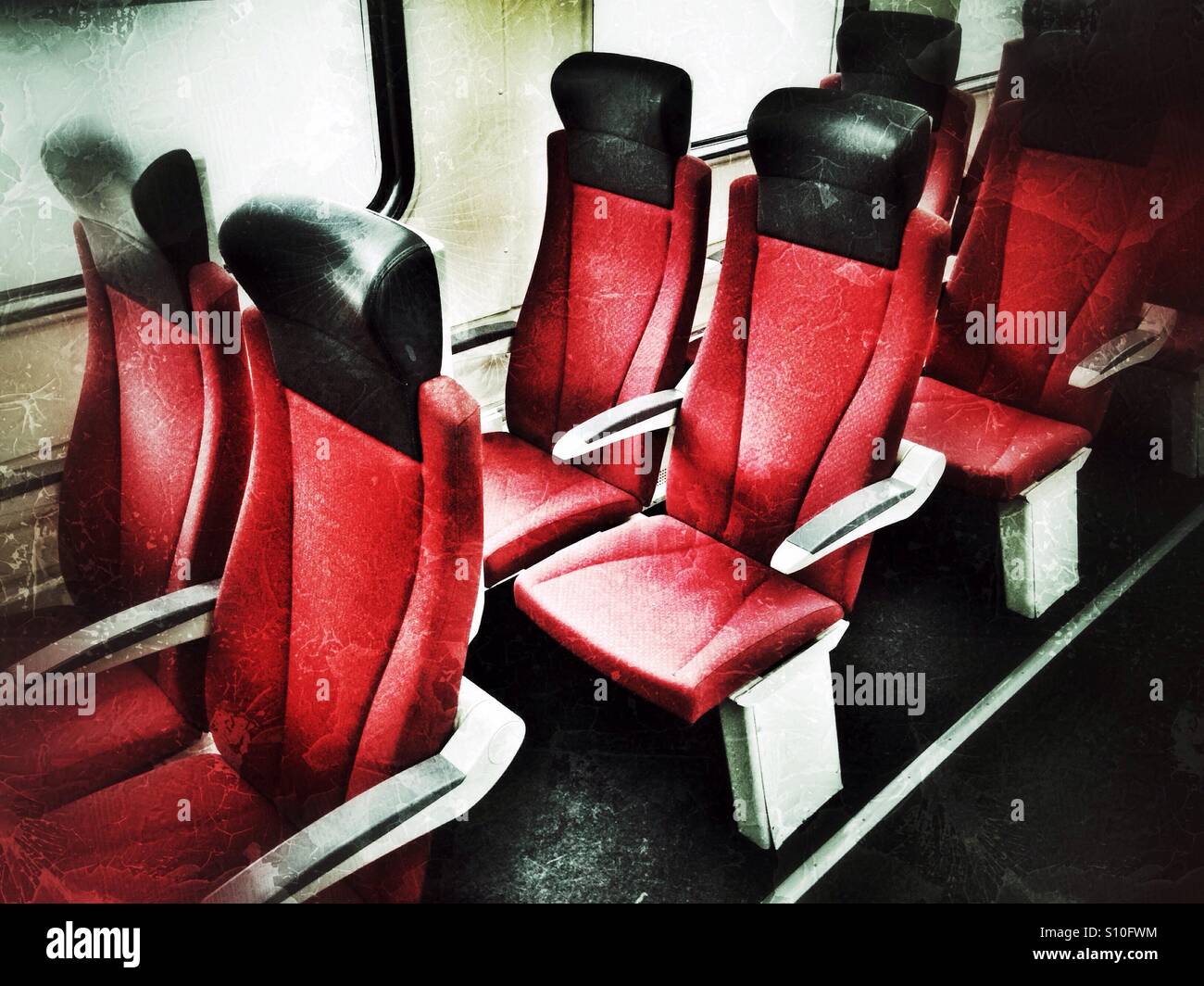 Rows of red seats inside a train Stock Photo - Alamy
