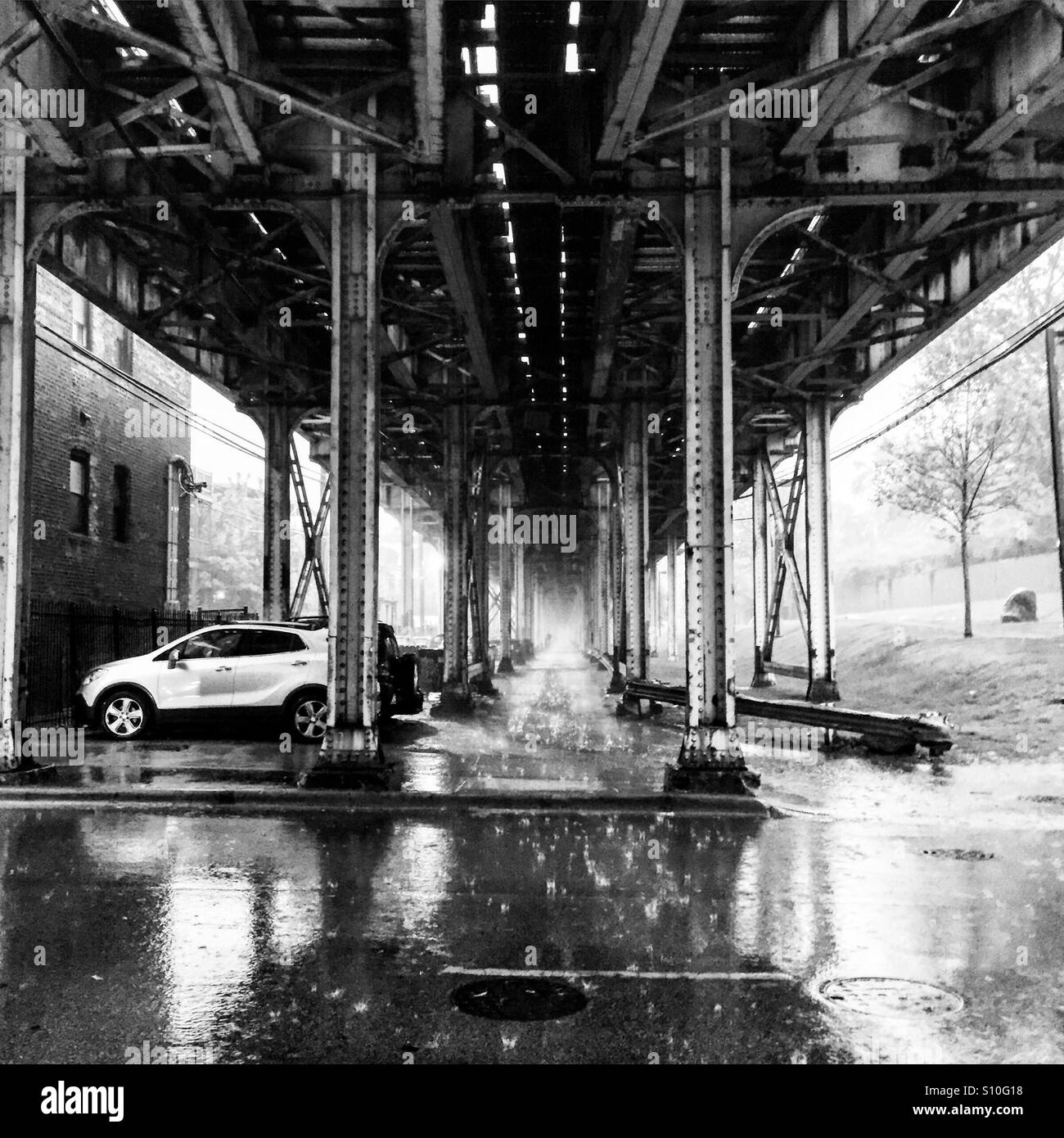 Rain falling under elevated train tracks in Chicago Stock Photo - Alamy