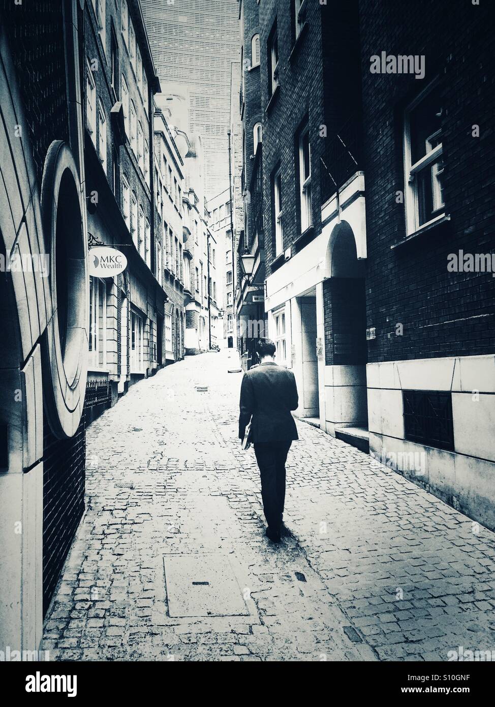Man walking down alley hi-res stock photography and images - Alamy