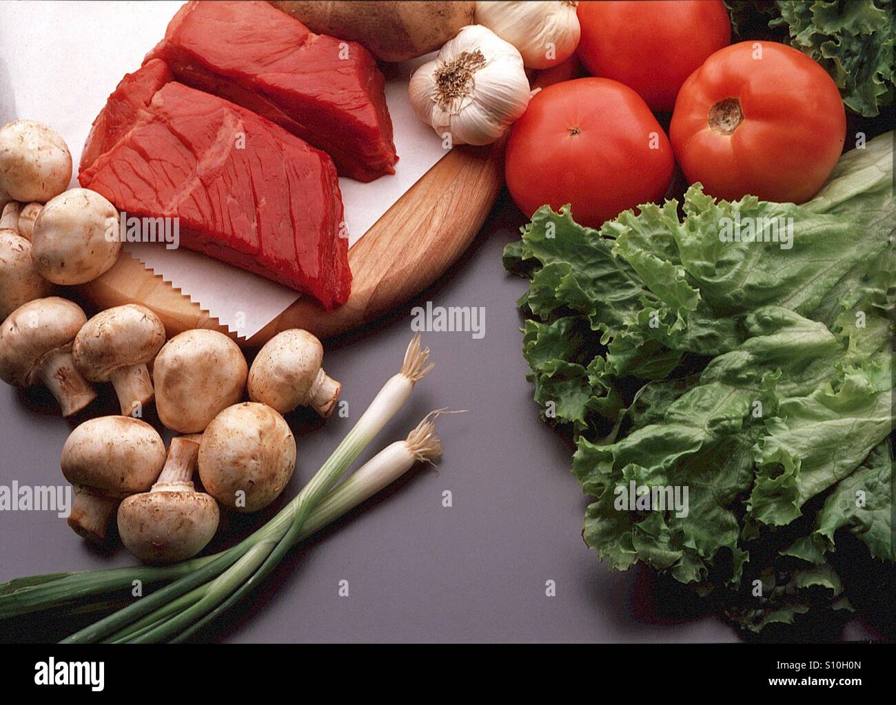 Raw steak and veggies Stock Photo - Alamy