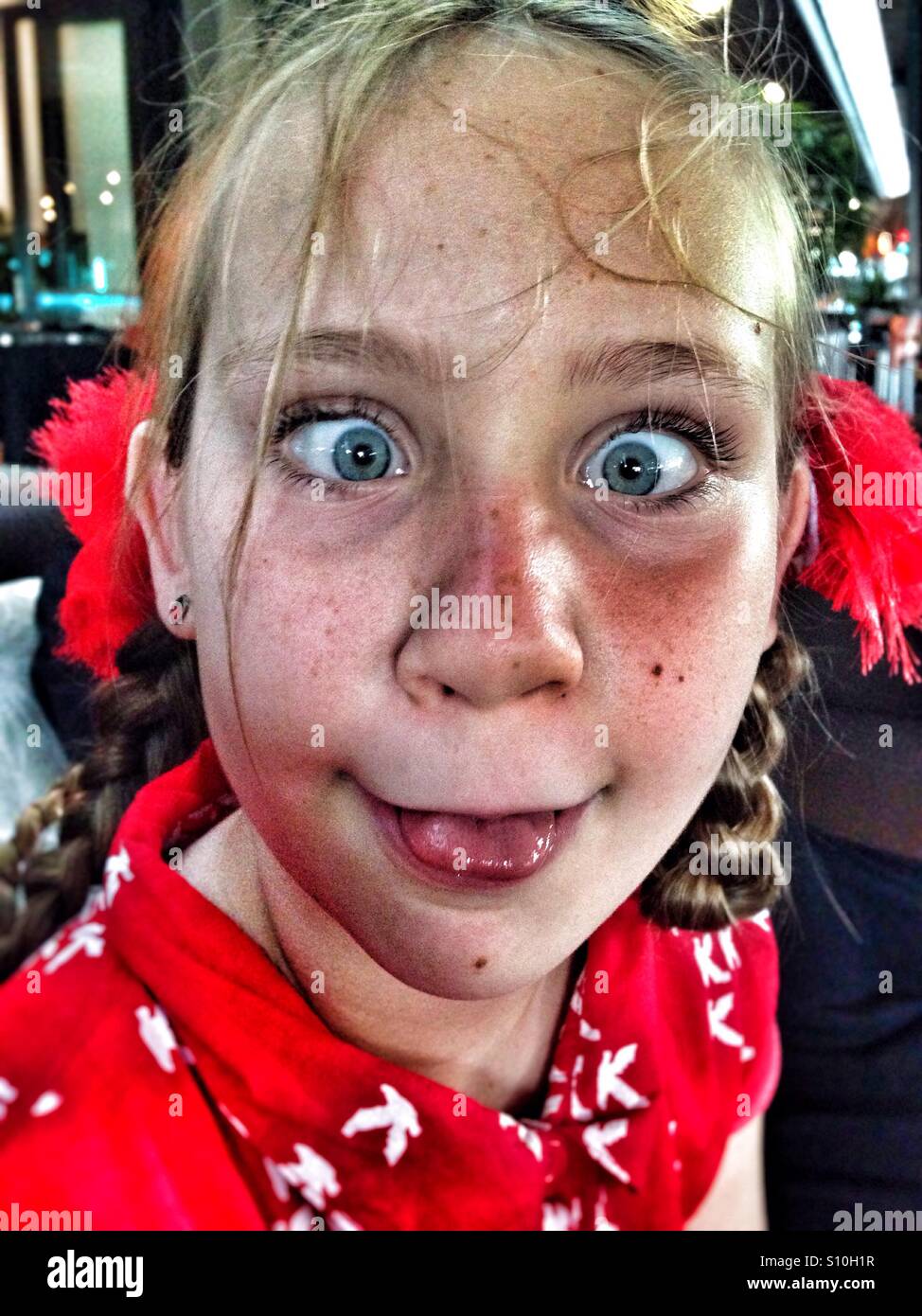 Little girl pulling faces Stock Photo - Alamy