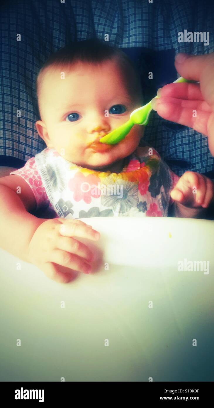 Baby the chair eating his food hi-res stock photography and images - Alamy