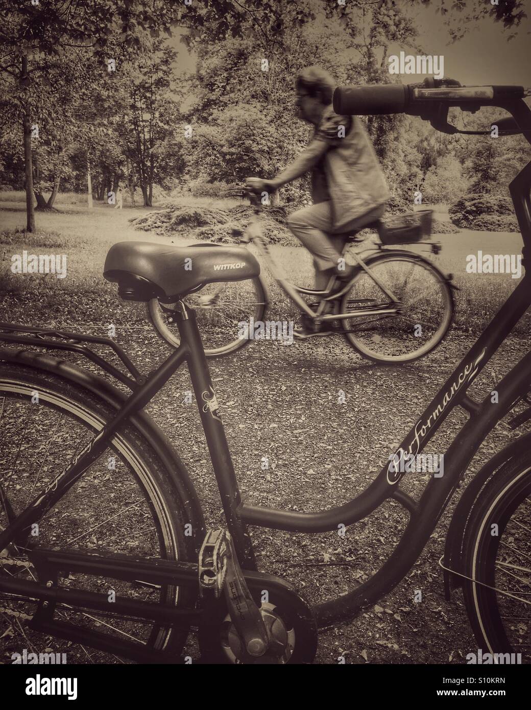 Old lady riding a bike hi-res stock photography and images - Alamy