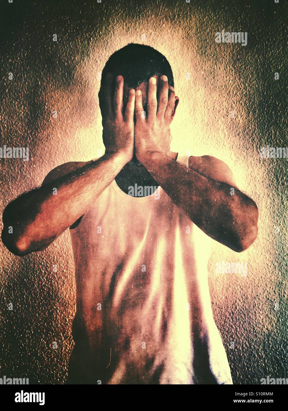 Man hiding his face with hands Stock Photo - Alamy