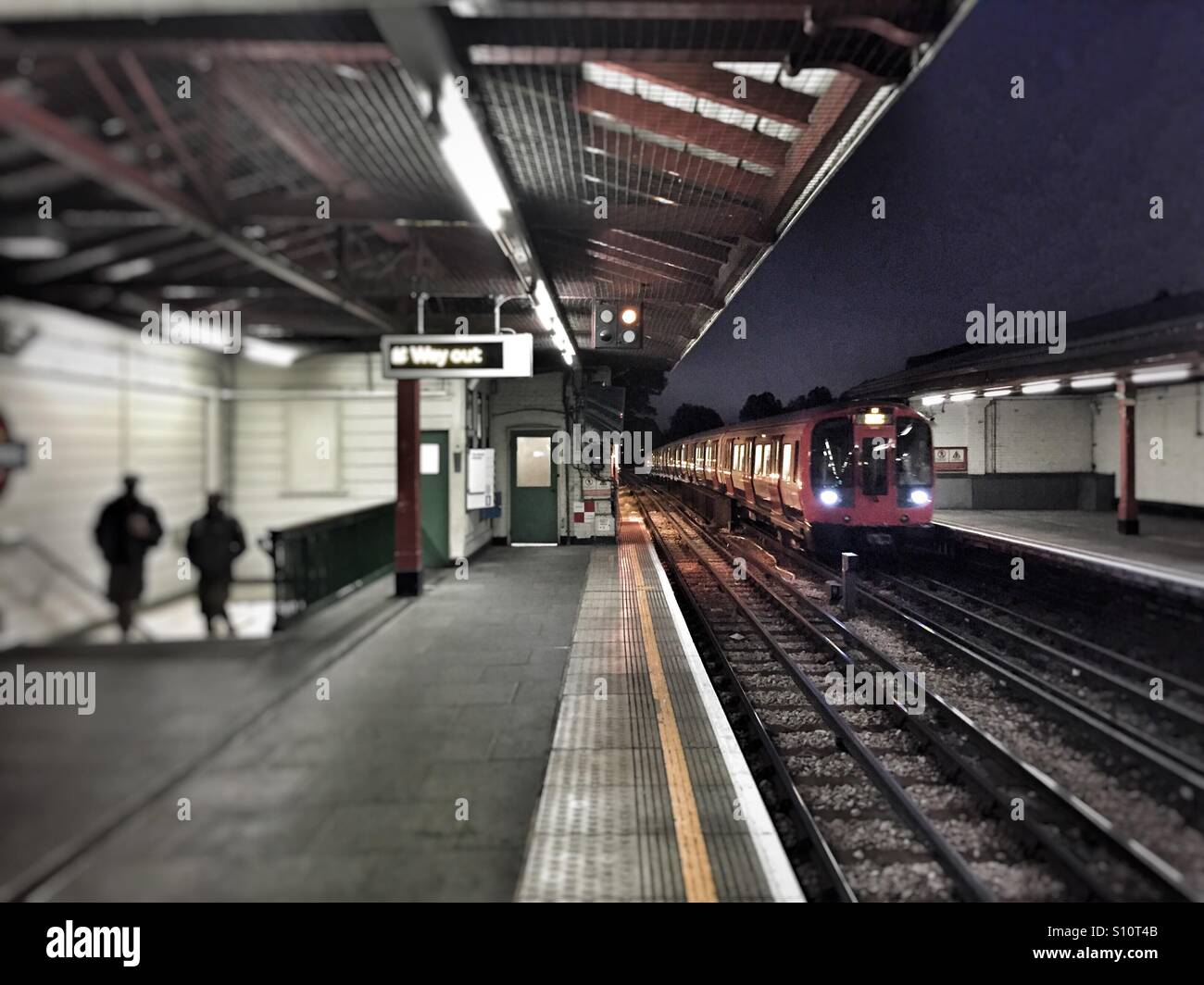 Train approaching platform at a station in London, UK Stock Photo - Alamy
