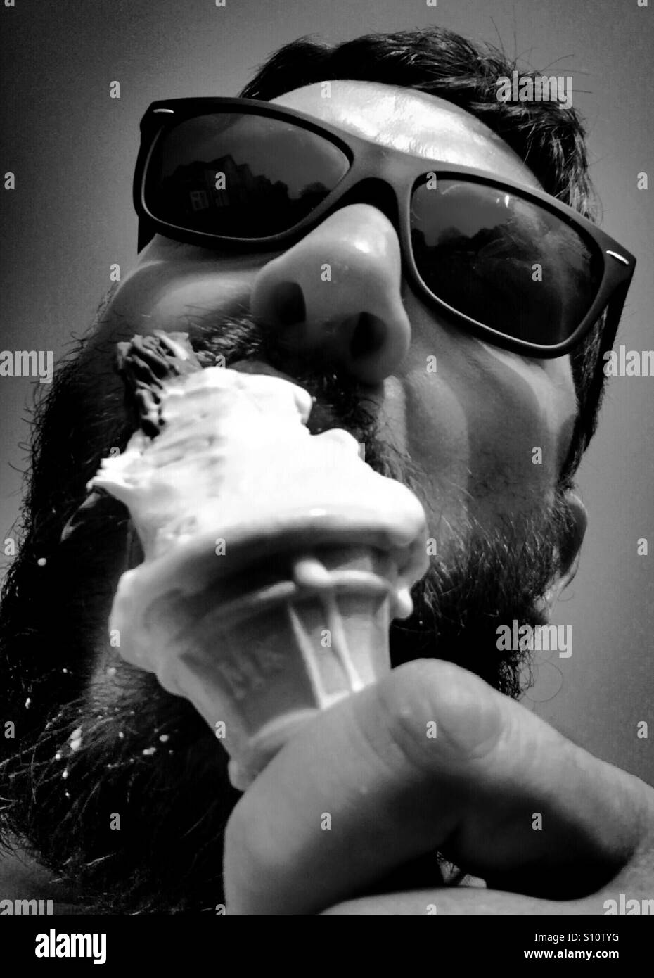 Man Eating Ice Cream Cone Black and White Stock Photos & Images - Alamy