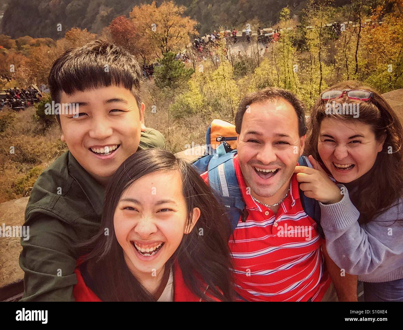 Smiling friends outdoors Stock Photo - Alamy
