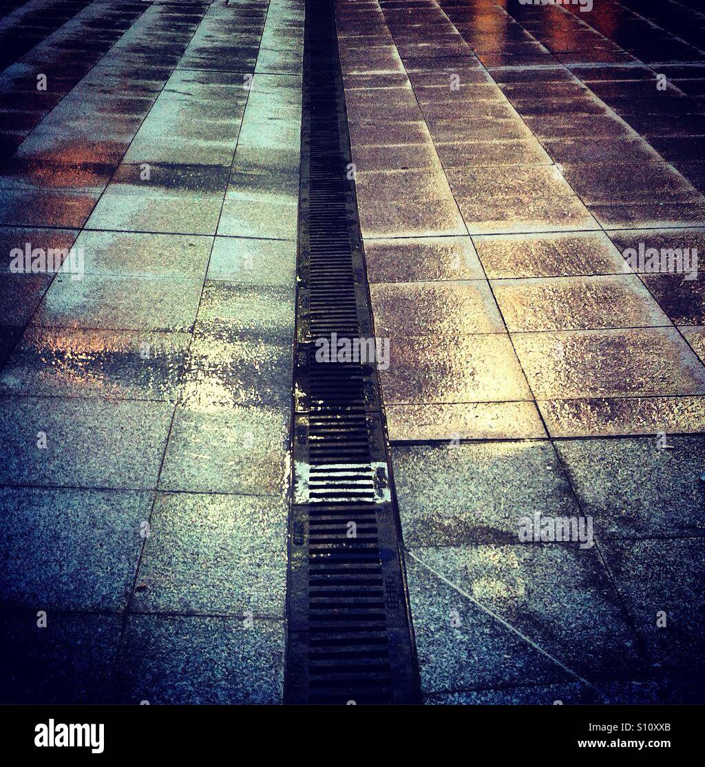 Wet floor in the street pavement Stock Photo - Alamy
