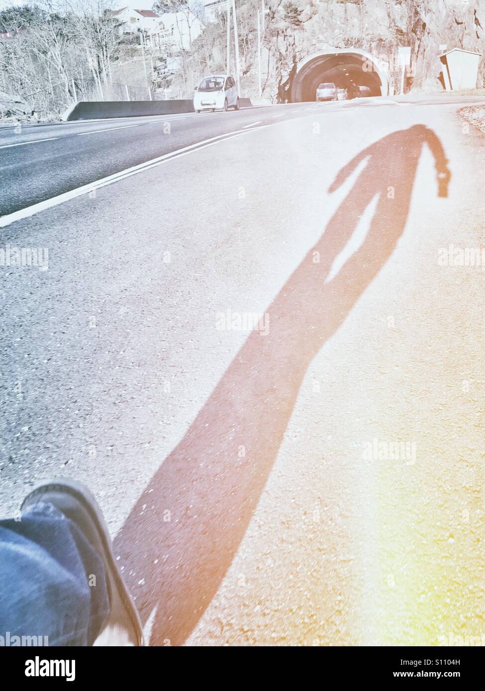 Walking man shadow on the pavement hi-res stock photography and images ...