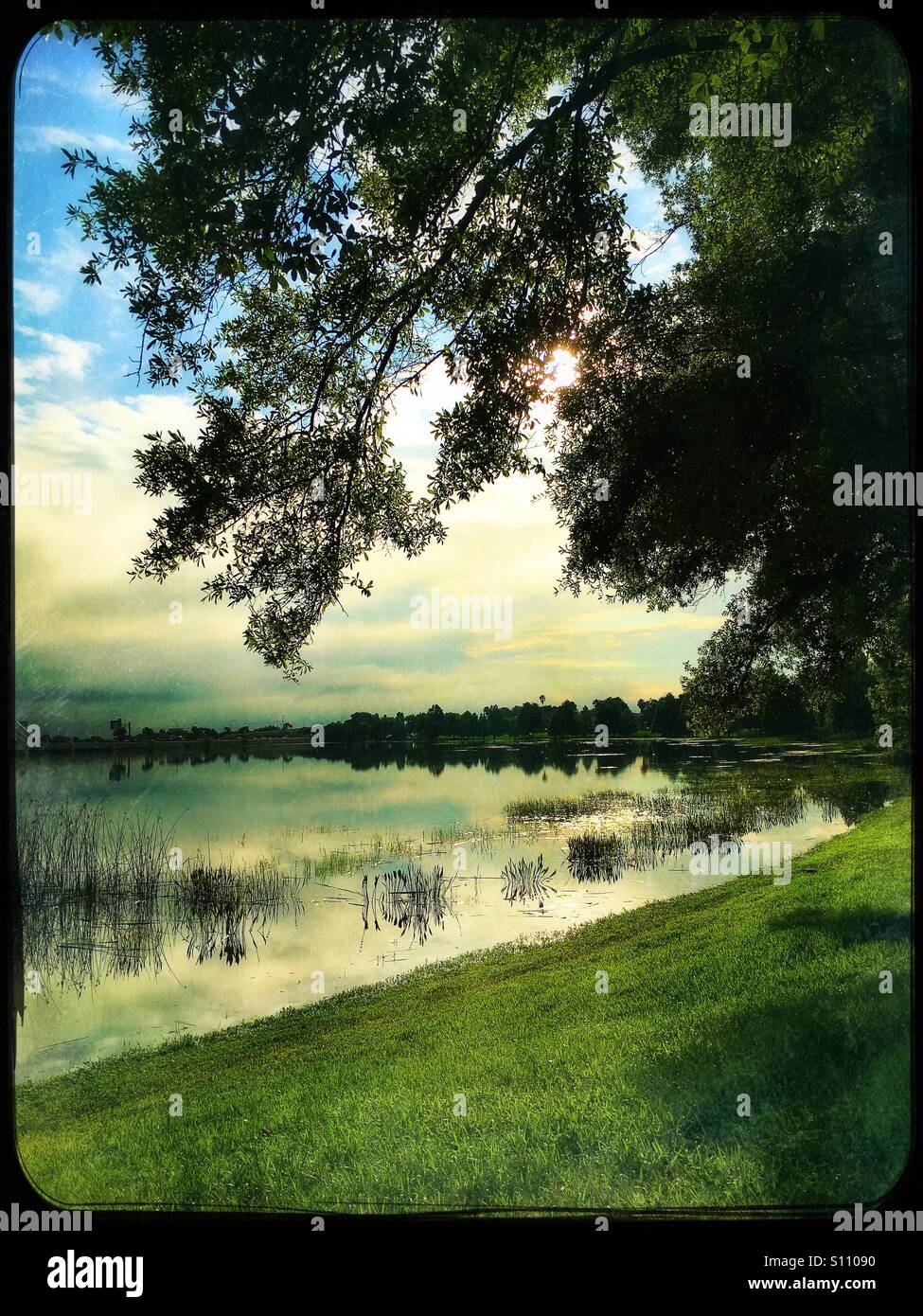 Clouds reflected in lake Stock Photo - Alamy