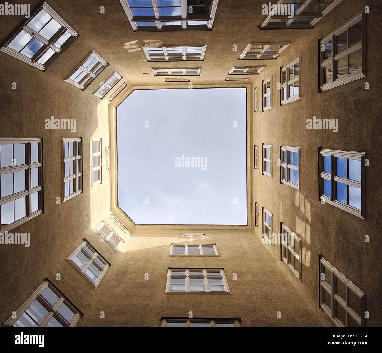 Low angle shot of building with windows Stock Photo - Alamy