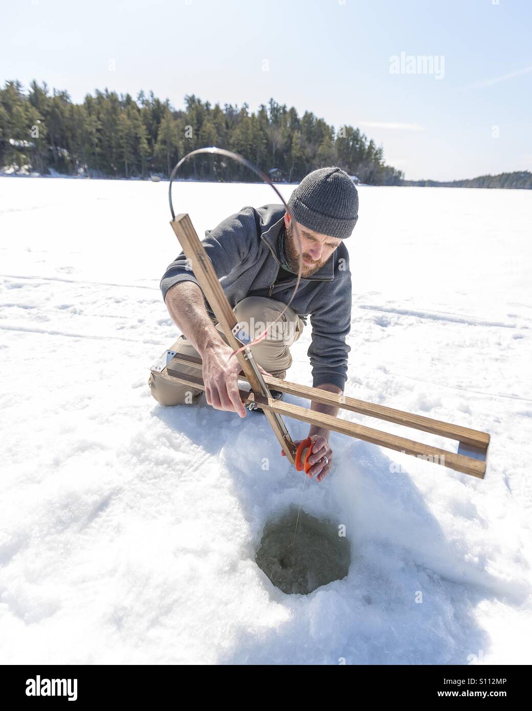 Man ice fishing hi-res stock photography and images - Alamy