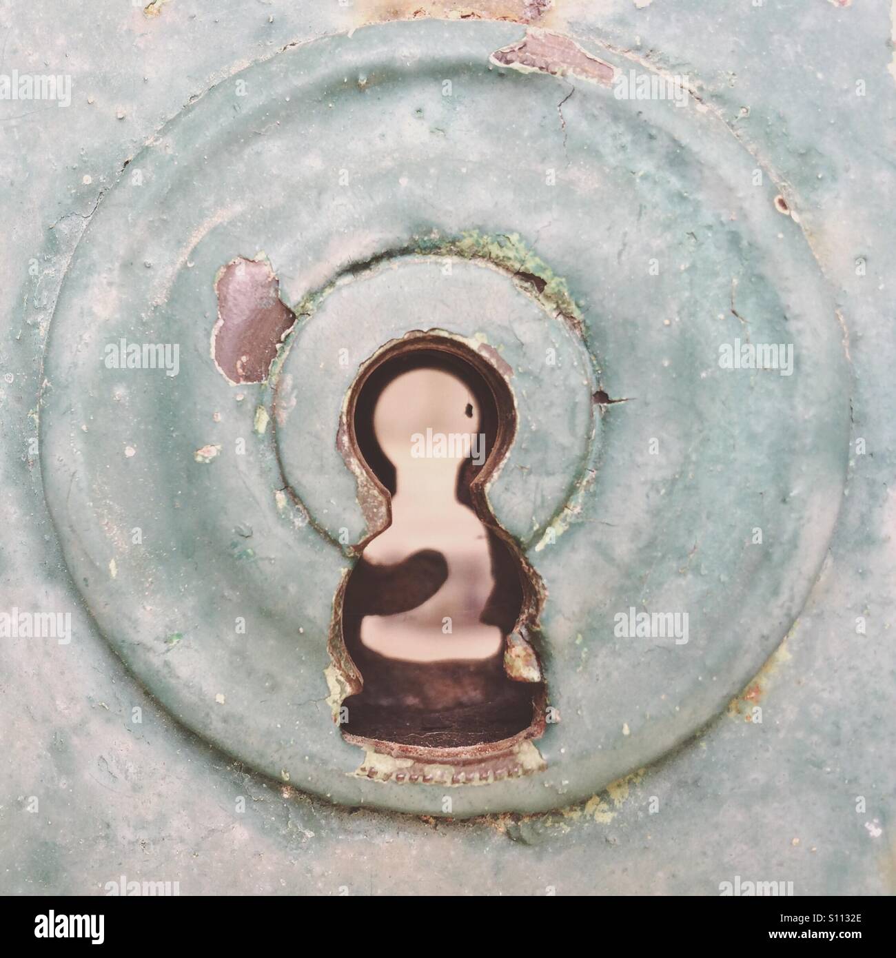 Looking through an old key lock Stock Photo - Alamy