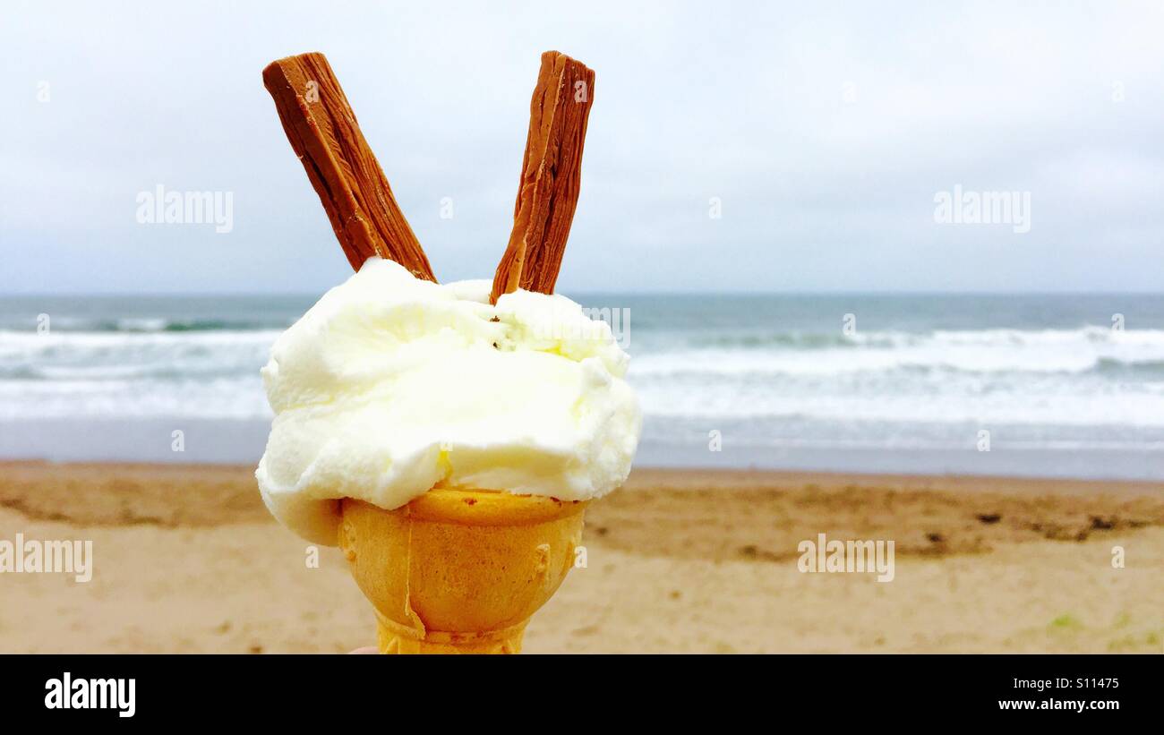 Two chocolate flakes in a vanilla ice cream Stock Photo - Alamy