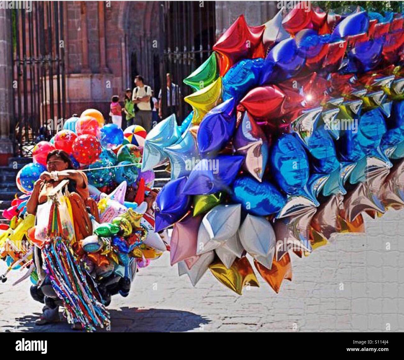 Lady selling balloons hi-res stock photography and images - Alamy