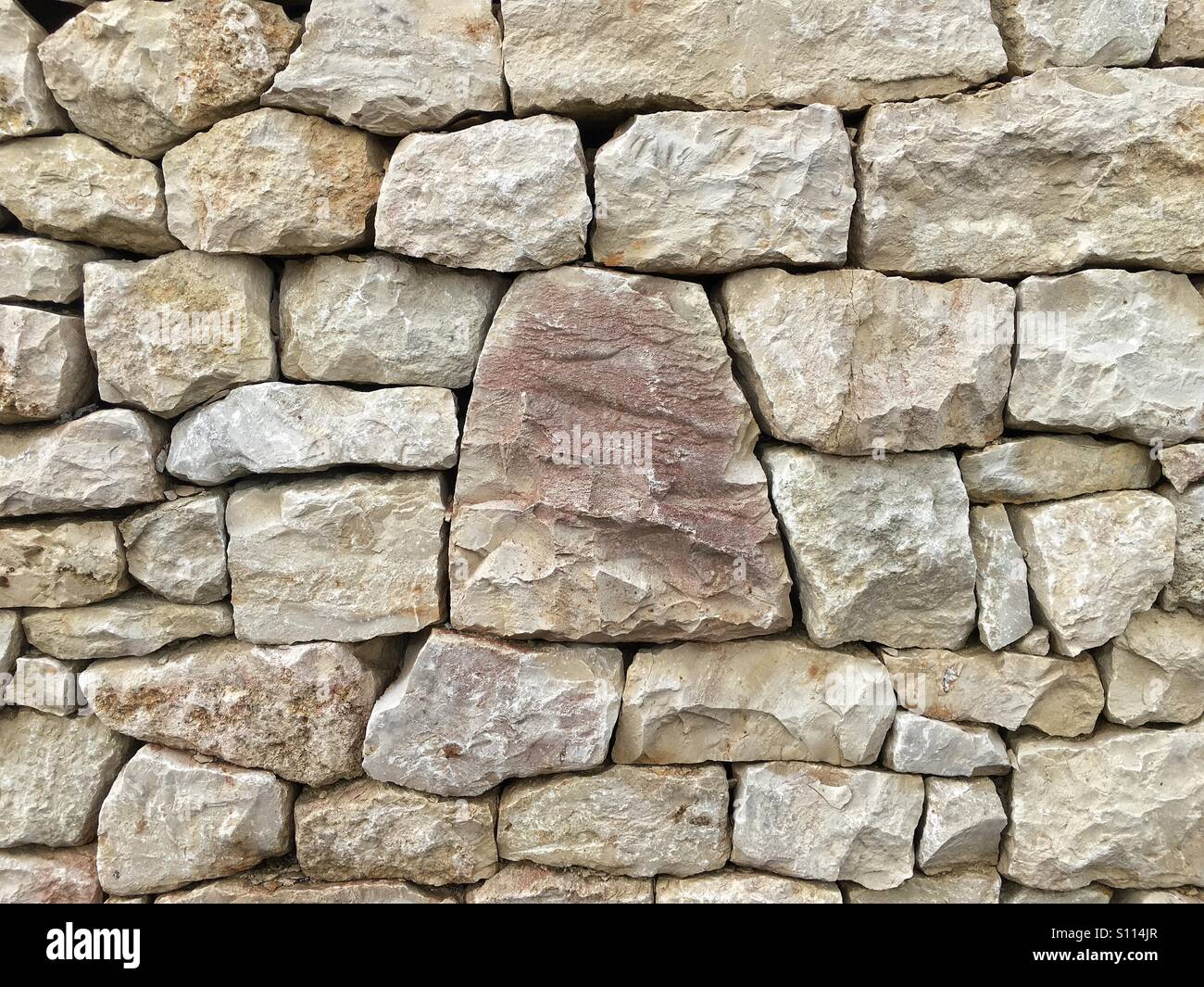 Close-up of a stone wall Stock Photo - Alamy