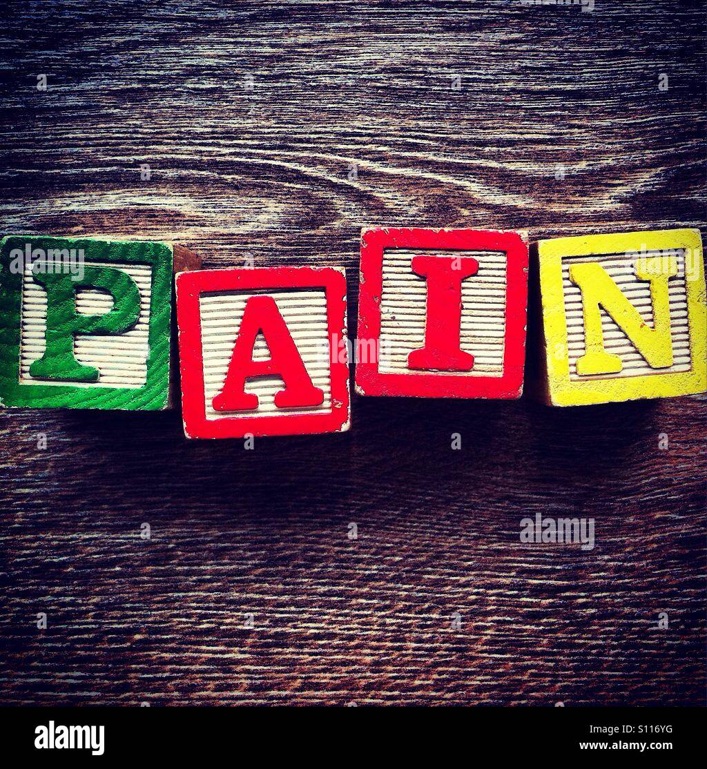 Word PAIN done with wodd blocks alphabet letter Stock Photo - Alamy