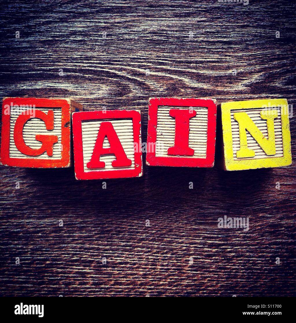 Word GAIN done with wood blocks alphabet letters Stock Photo - Alamy