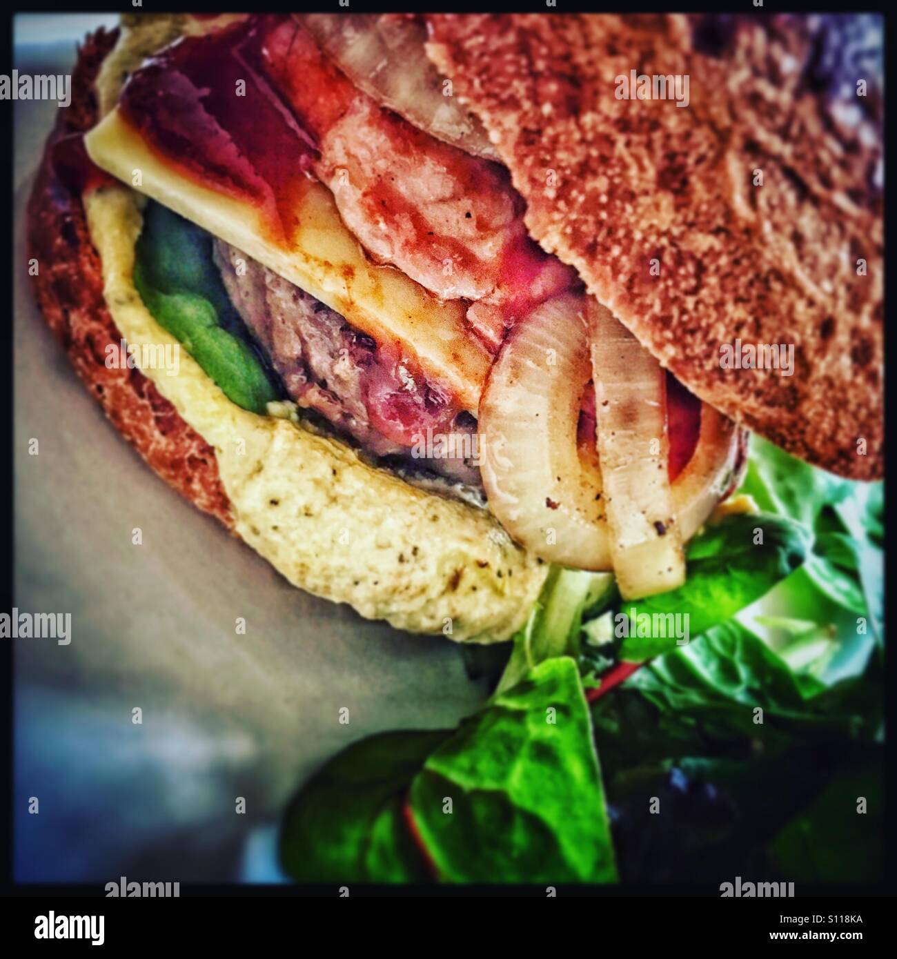 Fully loaded burger with all the trimmings Stock Photo - Alamy