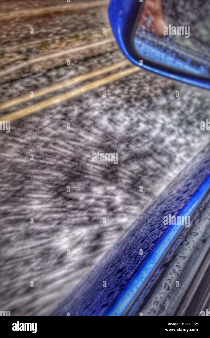 Car splashes through puddle Stock Photo - Alamy
