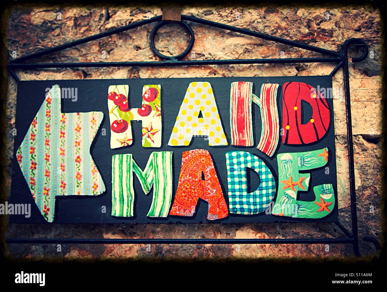 Hand made pointer near handicraft shop Stock Photo - Alamy