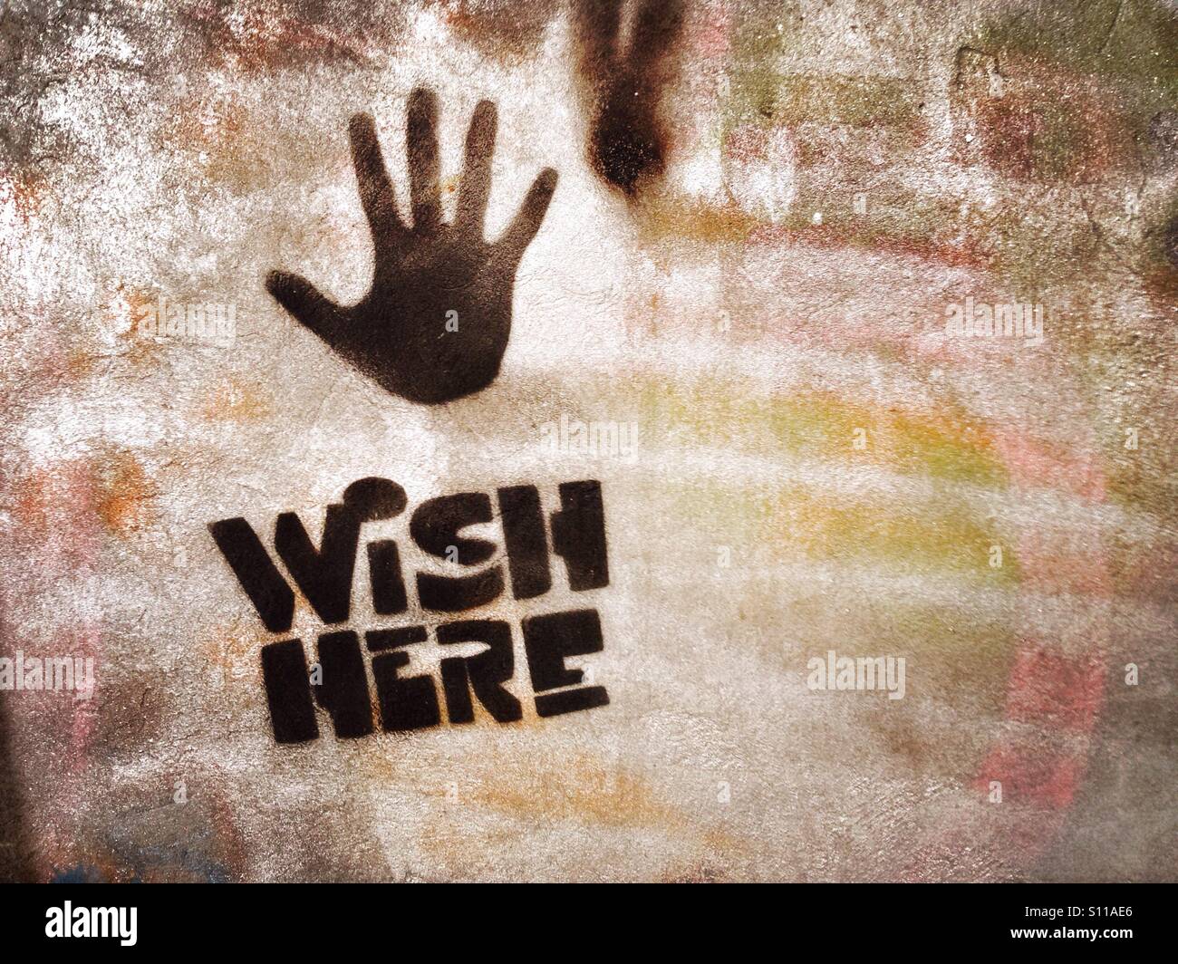 A humorous stencil graffiti on a wall in the Berlin district Kreuzberg ...