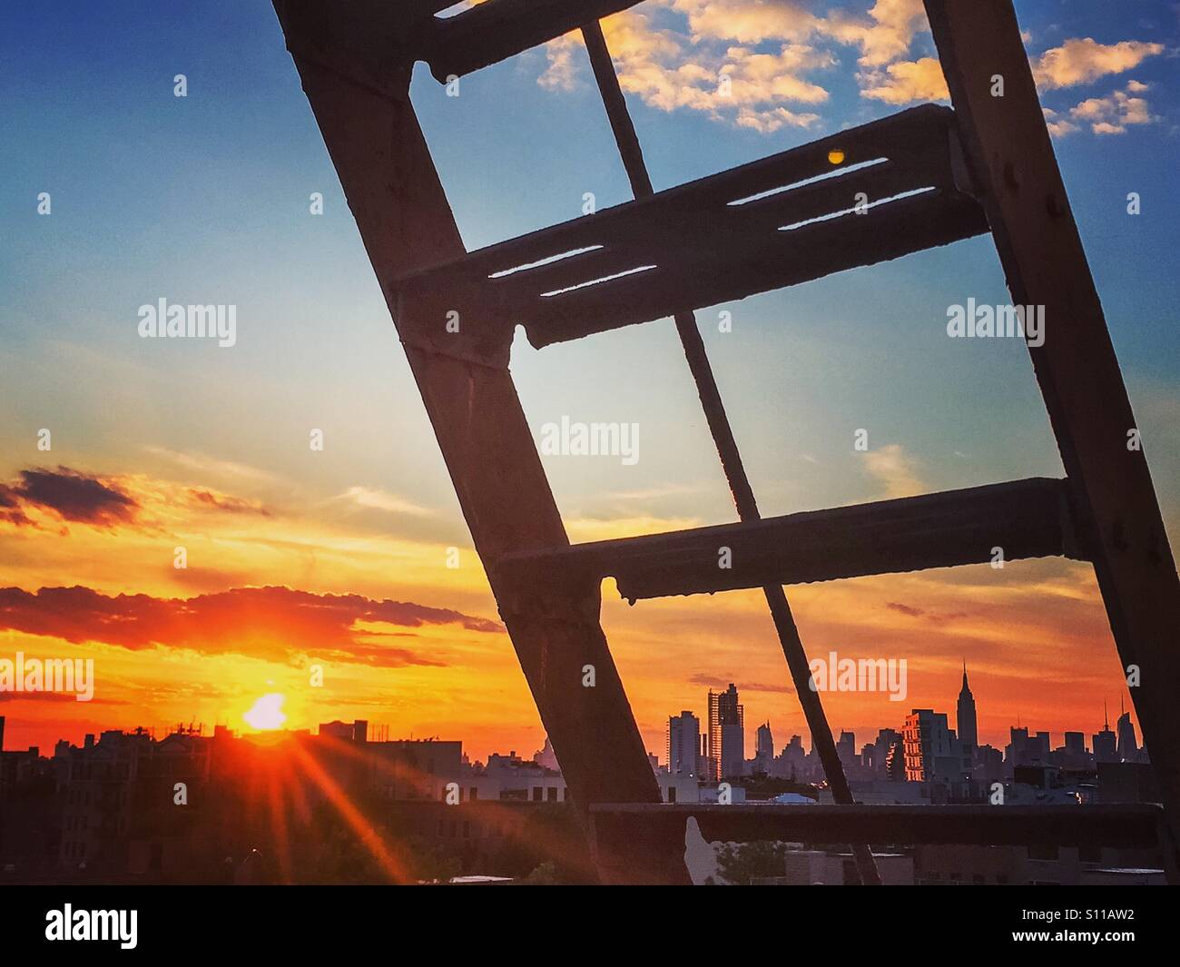 NYC sunset through window of an apartment building in Williamsburg ...